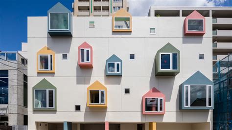 Colourful House Shaped Boxes Surround Windows At Nursery School