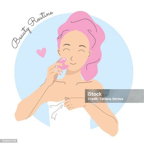 샤워 후 수건에 있는 뷰티 걸은 핑크 쿼츠 스톤 페이셜 마사지를 사용하여 피부를 관리합니다 구아 샤 페이스 마사지 스크레이퍼와