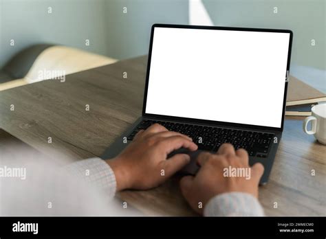 Back View Of Man Working Hands Typing On Laptop Keyboard Mock Up Of Computer Monitor Copyspace