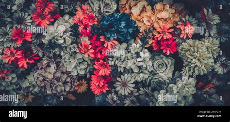 A Vintage Inspired Arrangement Of Artificial Flowers Showcasing A