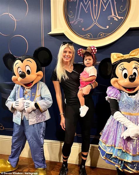 Devon Windsor With Husband And Daughter At Disney World In Florida