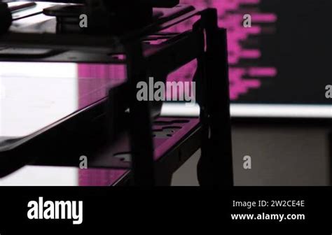 Pink Computer Software Code Moving On A Black Monitor Reflect On Glass Abstract Computer
