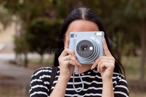 Close Up Portrait Of A Young Brunette Girl On The Street She Is