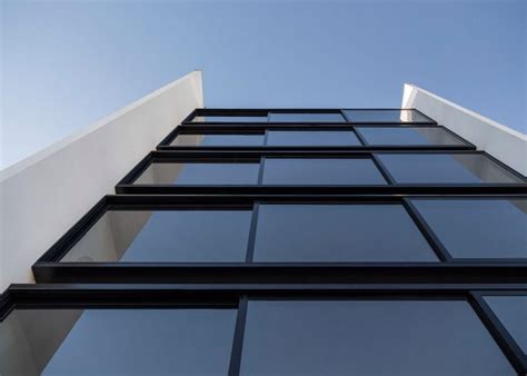 apartment tower by arquitetura nacional features a wall of sliding windows