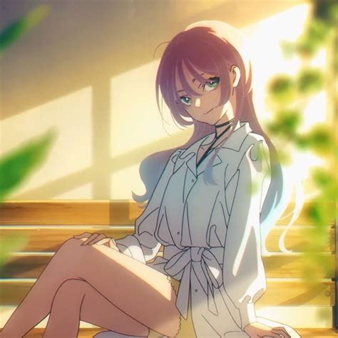 A Woman Sitting On Top Of A Wooden Bench Next To A Plant In A Room