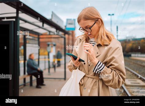 Happy Female Traveler By Kiosk Machine For Travel Application Document