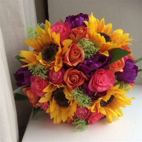 A Brides Bouquet Of Sunflowers Roses Ranunculus And Tulips