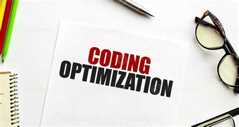 Coding Optimization On Paper With Glasses Pen And Colourful Pencils