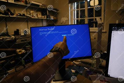 Tech Pro Analyzing Computer System On Multiple Displays Editorial Image