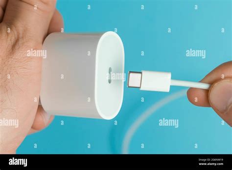 Usb Type C Cable Inserting To Adapter Plug By Man On The Blue Background Stock Photo Alamy