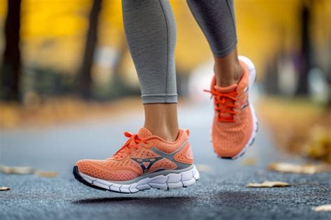 Premium Photo A Runner Wearing Orange Shoes Is Running On The Road