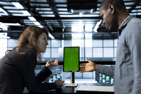 Programmers In Data Center Brainstorming Using Mockup Tablet Stock