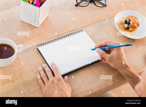 Man Writing Notes On Notebook Stock Photo Alamy