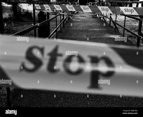 do not cross safety line on pedestrian bridge monochrome hues stock