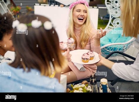 A Group Of Girlfriends Enjoying Themselves At A Bachelorette Party The