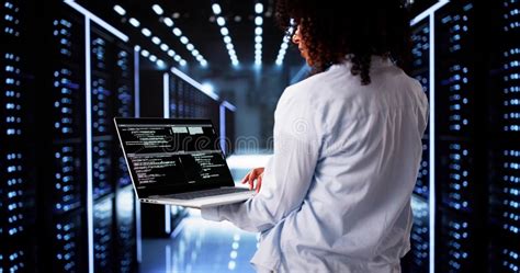 Cloud Computer Engineer Coding In Server Room In Data Center Stock