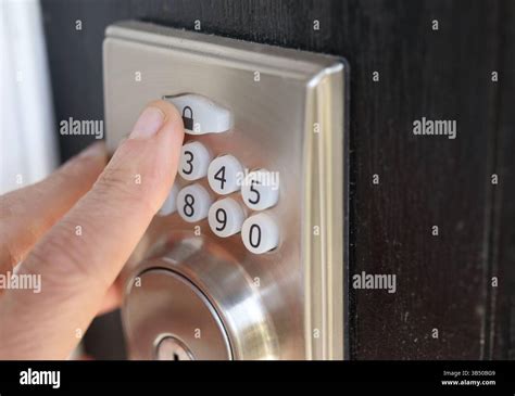 Person Using Electric Door Keypad Close Up Finger On Keyless Door