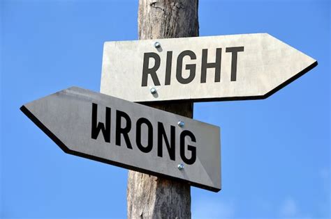Premium Photo Right And Wrong Wooden Signpost With Two Arrows