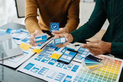 Ux Developer And Ui Designer Brainstorming About Mobile App Interface