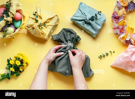 Wrapping A Gift In Eco Friendly Reusable Fabric Package Stock Photo Alamy