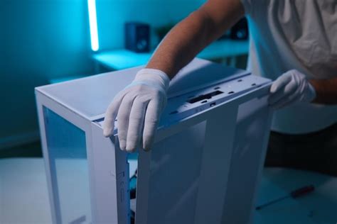 Premium Photo Rear View Of A Young Man Installing Graphics Card To