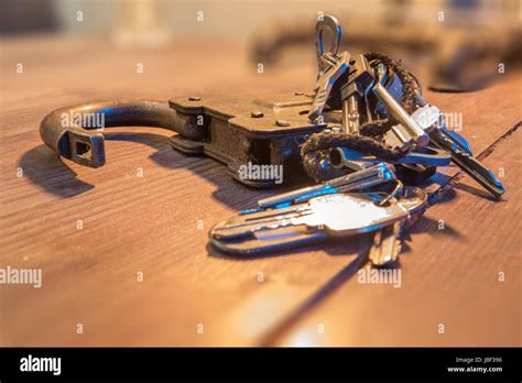 An Old Padlock With A Bunch Of Keys On A Rope Stock Photo Alamy