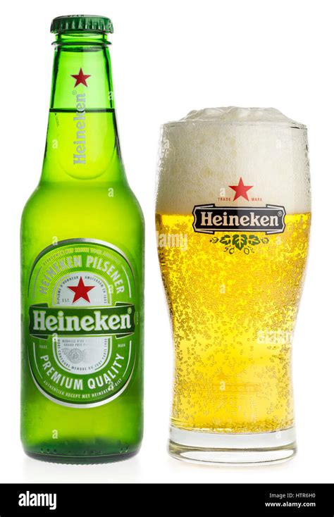 Bottle And Glass Of Heineken Pilsener Beer Isolated On A White