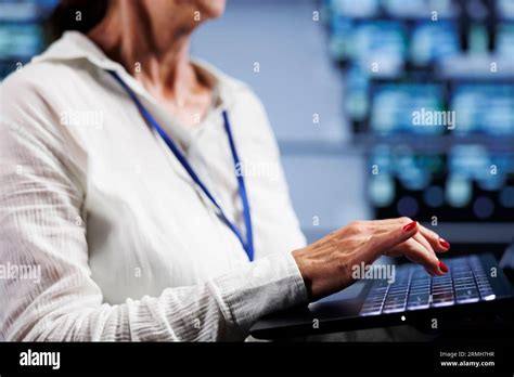 System Admin Working On Laptop Setting Up High Bandwidth Dedicated