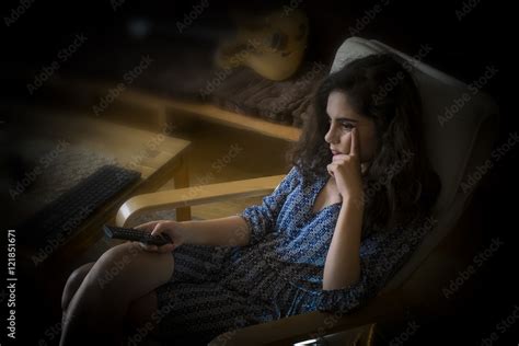 Girl With Tv Remote Stock Photo Adobe Stock