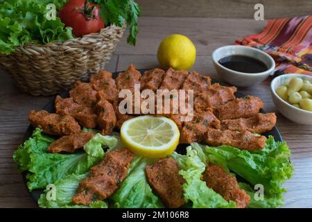 Turkish Cig Kofte” Close Up Turkish Meatballs Cut Into Lettuce