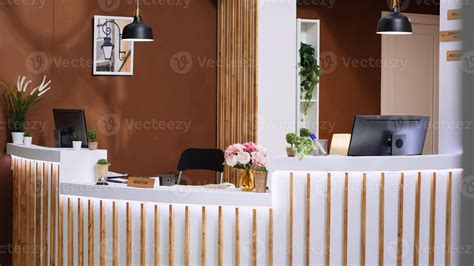 Stylish Hotel Reception Desk And Lounge Area Equipped With Trendy