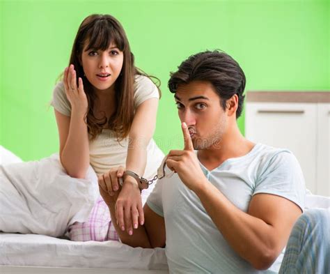 Man Suggesting Wife To Play Sexual Games With Cuffs Stock Photo Image Of Game Relationship