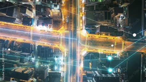 Street Intersection At Night With Modern Data Visualization Overlays