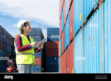 Engineer Woman Or Foreman Manager In Container Depot Working With Digital Tablet For Control And