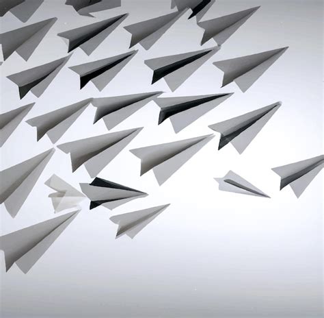 Premium Photo A Group Of Paper Planes With One Being Different From