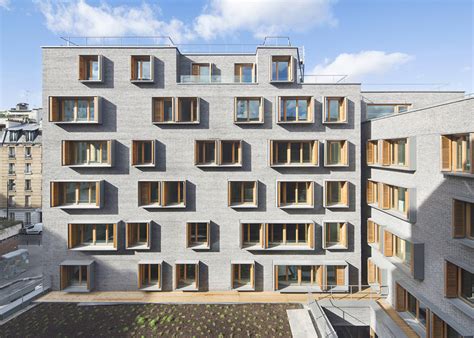 Michel Guthmann Pairs Grey Brick With Larch For Paris Housing Block
