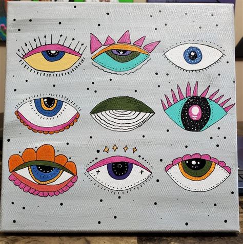An Art Work With Many Different Colored Eyes
