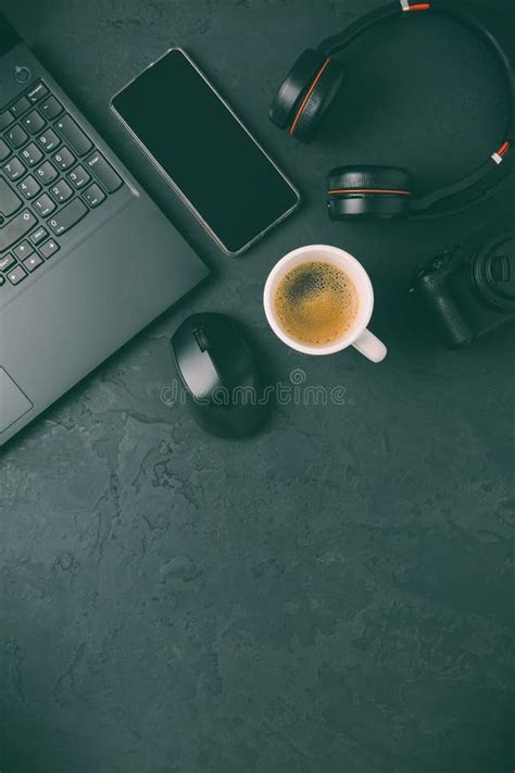 Office Table With Notebook Computer Keyboard Mouse Headphones Tablet Pc And Smartphone Stock