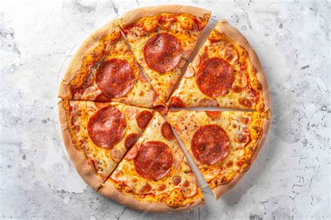 Premium Photo Top View Of Pepperoni Pizza Sliced Into Six Slices