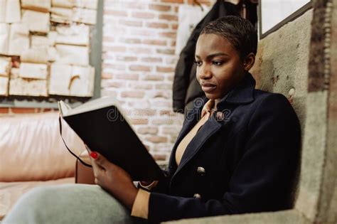 Beautiful African Girl Making Notes In Diary In Cafeteria Stock Photo Image Of Babe