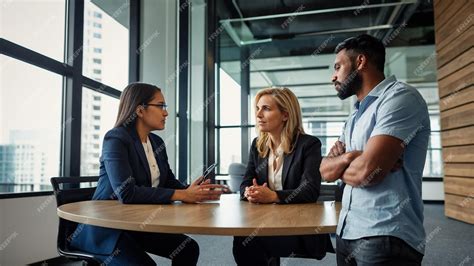 Premium Photo Two People Are Talking In A Conference Room