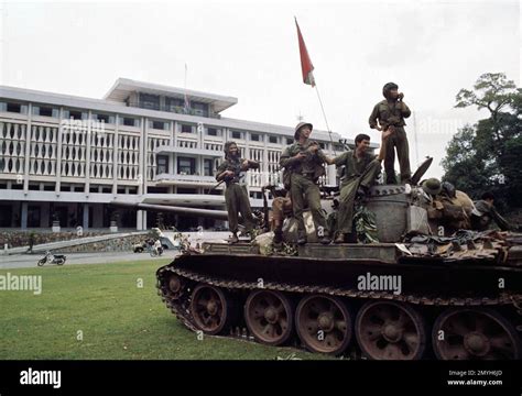 Victorious North Vietnamese Troops Aboard A Tank Take A Position