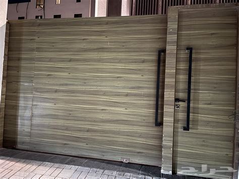 باب كراج منزلق مع باب رئيسى للمنزل موقع حراج