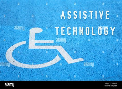 Assistive Technology Concept Written Words On Blue Pavement Background