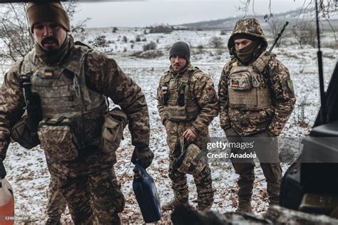 Ukrainian Soldiers Load Firewood At Their Position On The Donbass