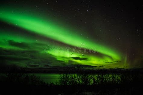 Stunning Aurora Borealis Illuminating The Night Sky Above The Rural