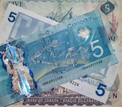 Five Canadian Dollar Banknotes Astronaut And Space Station On The 5