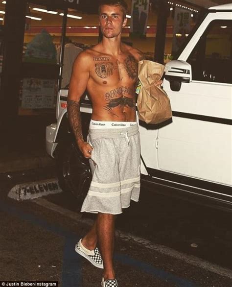 Justin Bieber Flaunts Heavily Tattooed Chest As He Reveals He S Spent Over Hours Getting