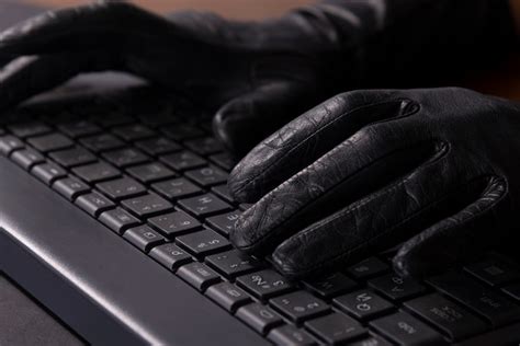 Premium Photo Cybercriminal Hands In Gloves On Laptop Keyboard