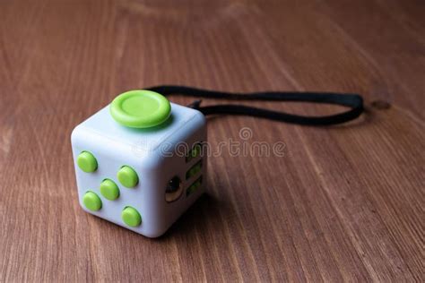 Fidget Cube With Green Buttons On A Wooden Table Stock Photo Image Of Craps Business 116826254
